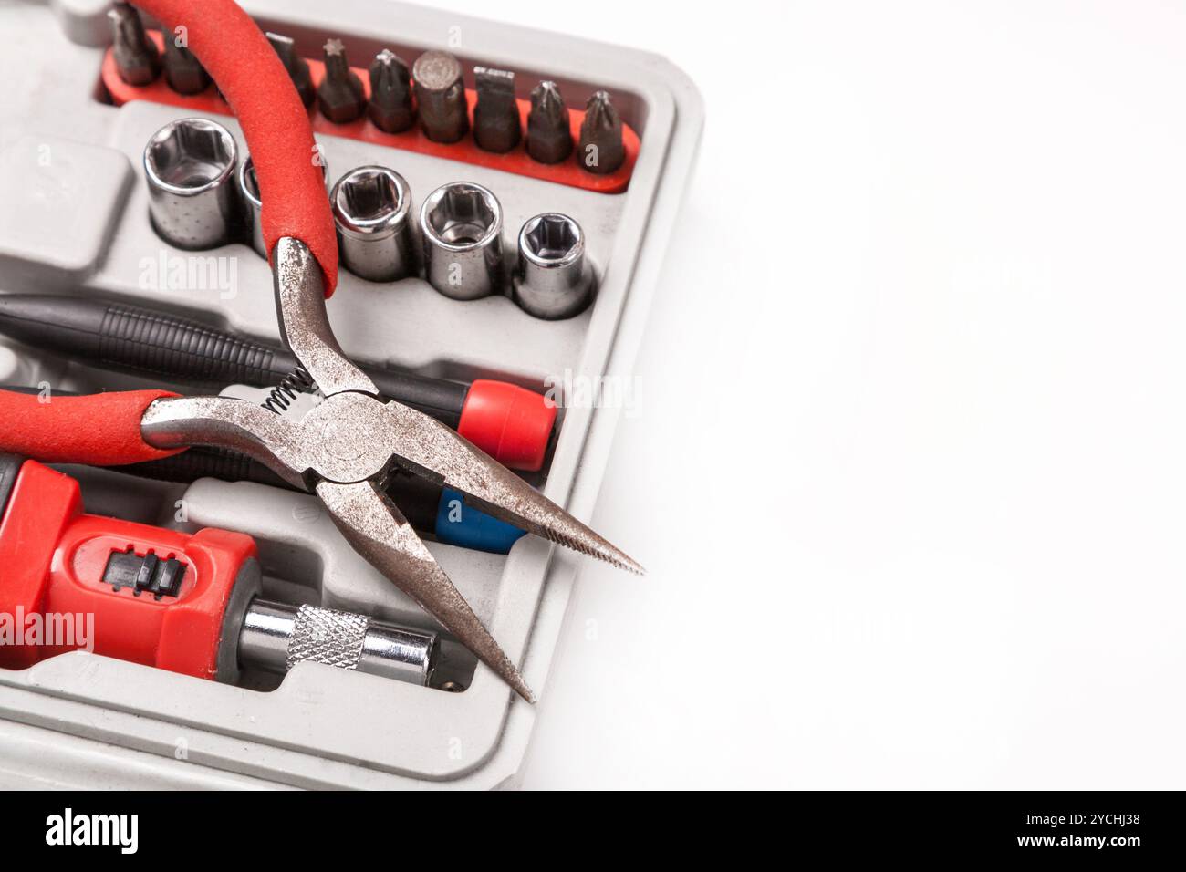 Open toolbox with screwdriver, heads and bit Stock Photo - Alamy