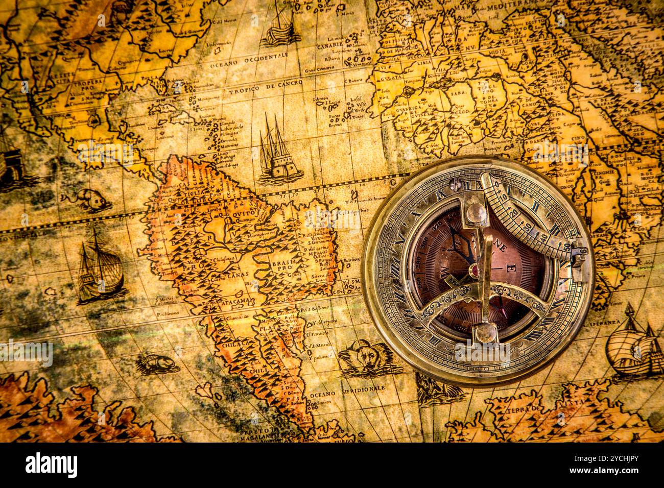 Vintage compass lies on an ancient world map Stock Photo - Alamy