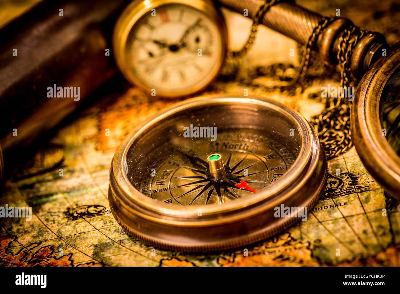 Vintage compass lies on an ancient world map Stock Photo - Alamy