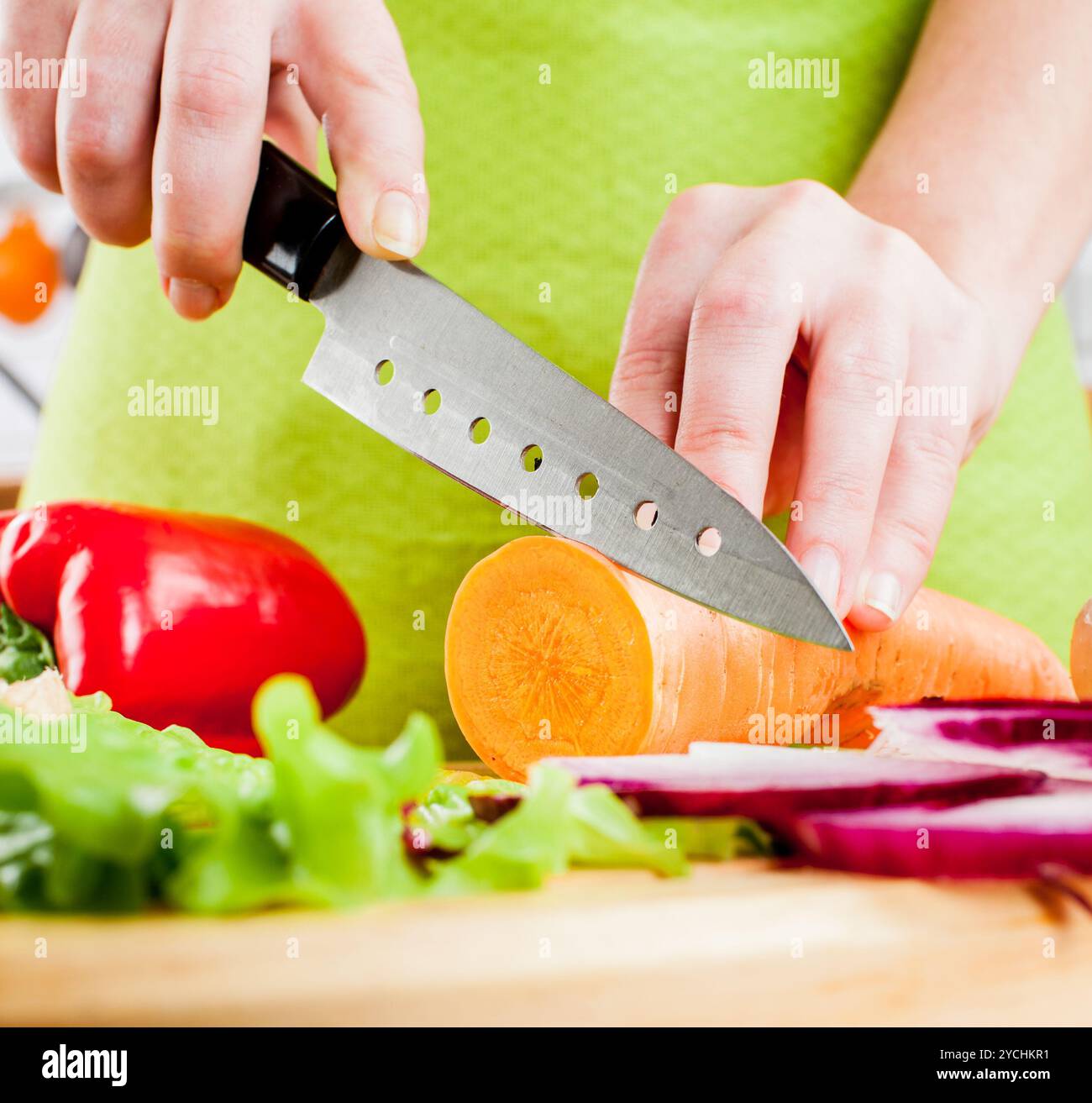 Woman's hands cutting vegetables Stock Photo - Alamy