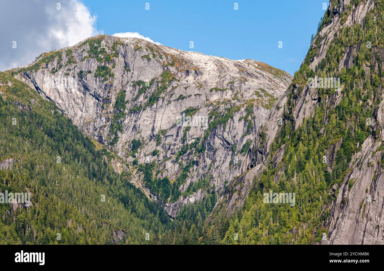 Towering mountains border the deep glacier-carved Kynoch Inlet fjord ...