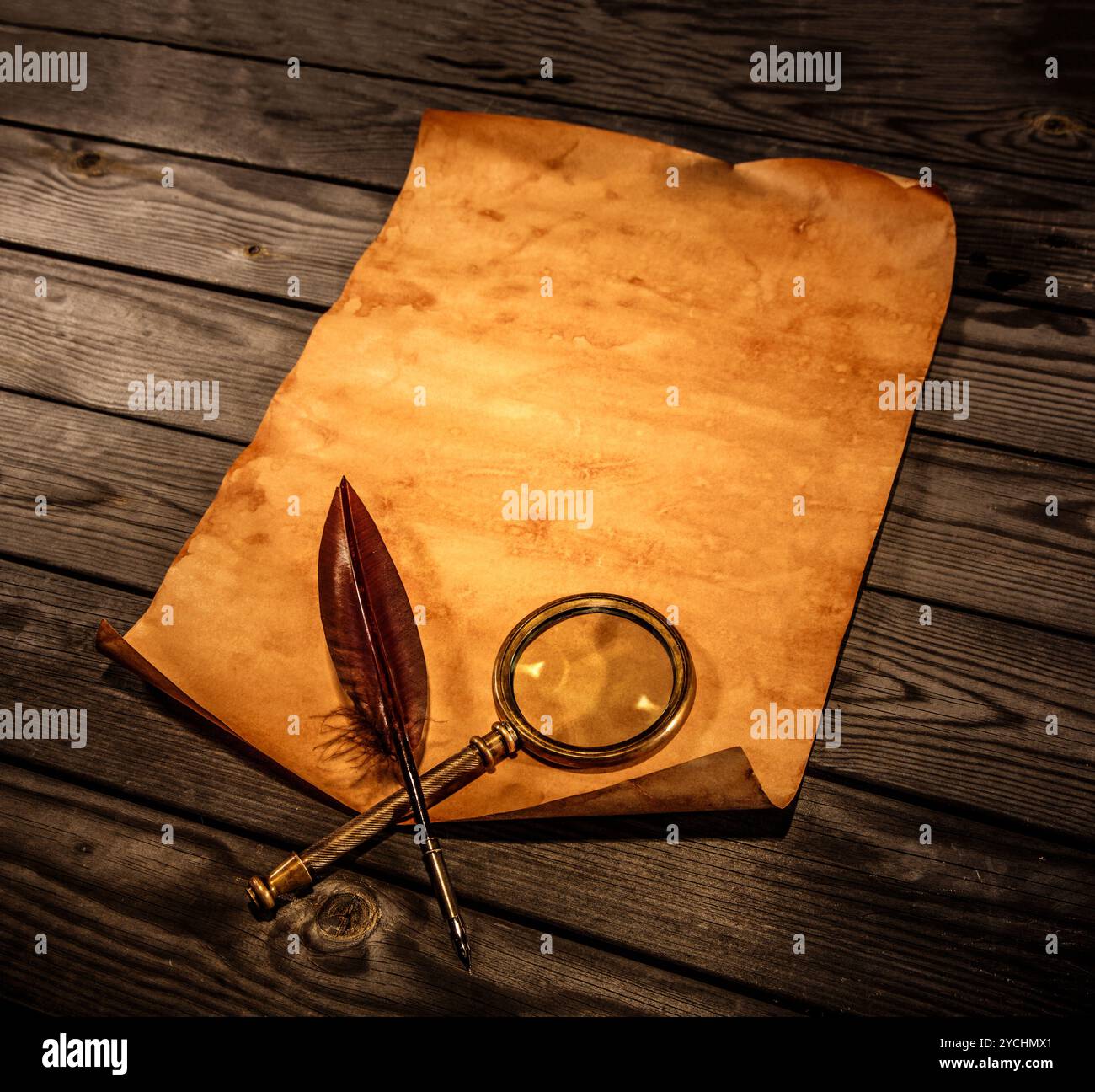 Blank old paper with curled edge against the background of an aged wood ...