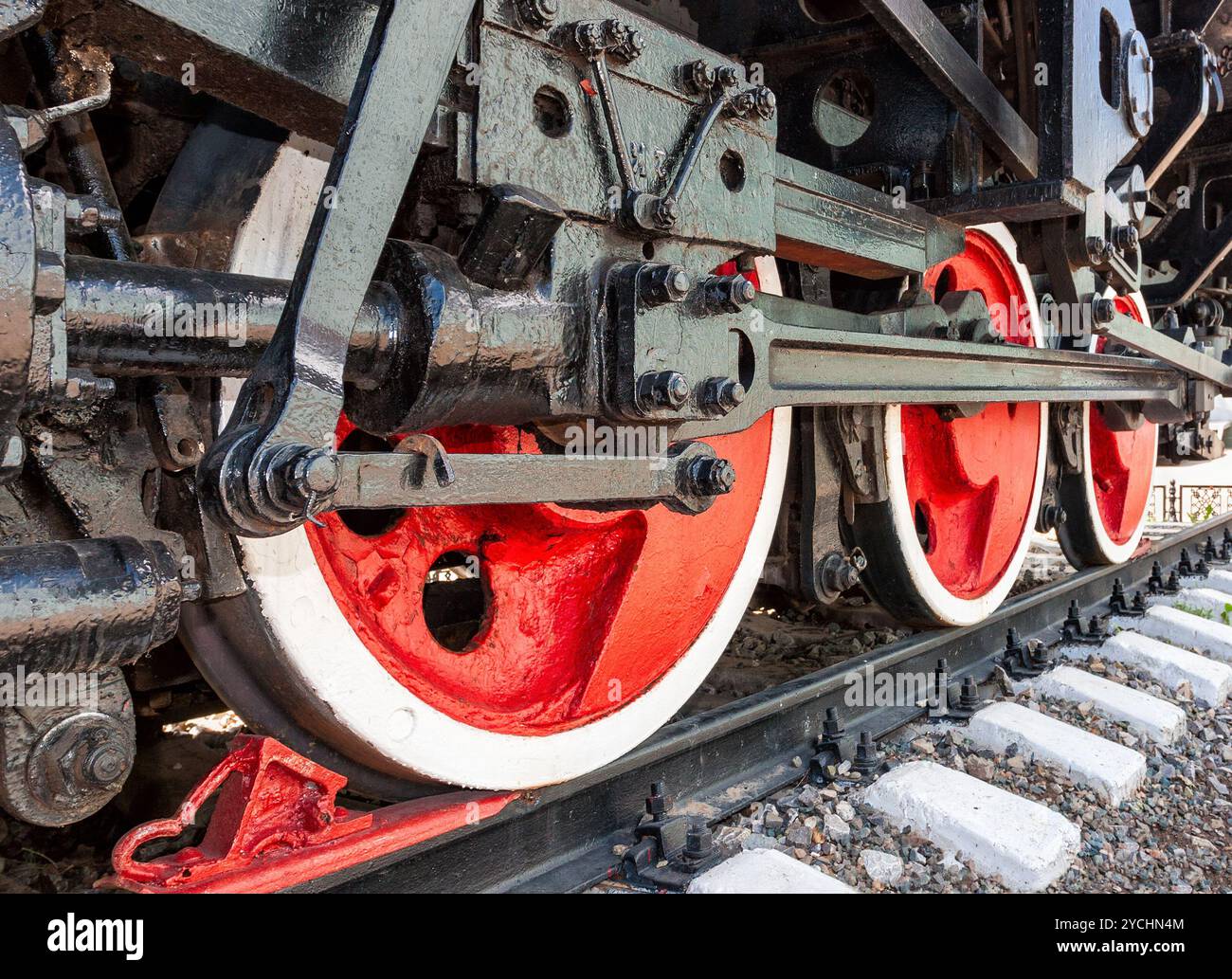 Old steam locomotive engine wheel and rods details Stock Photo - Alamy
