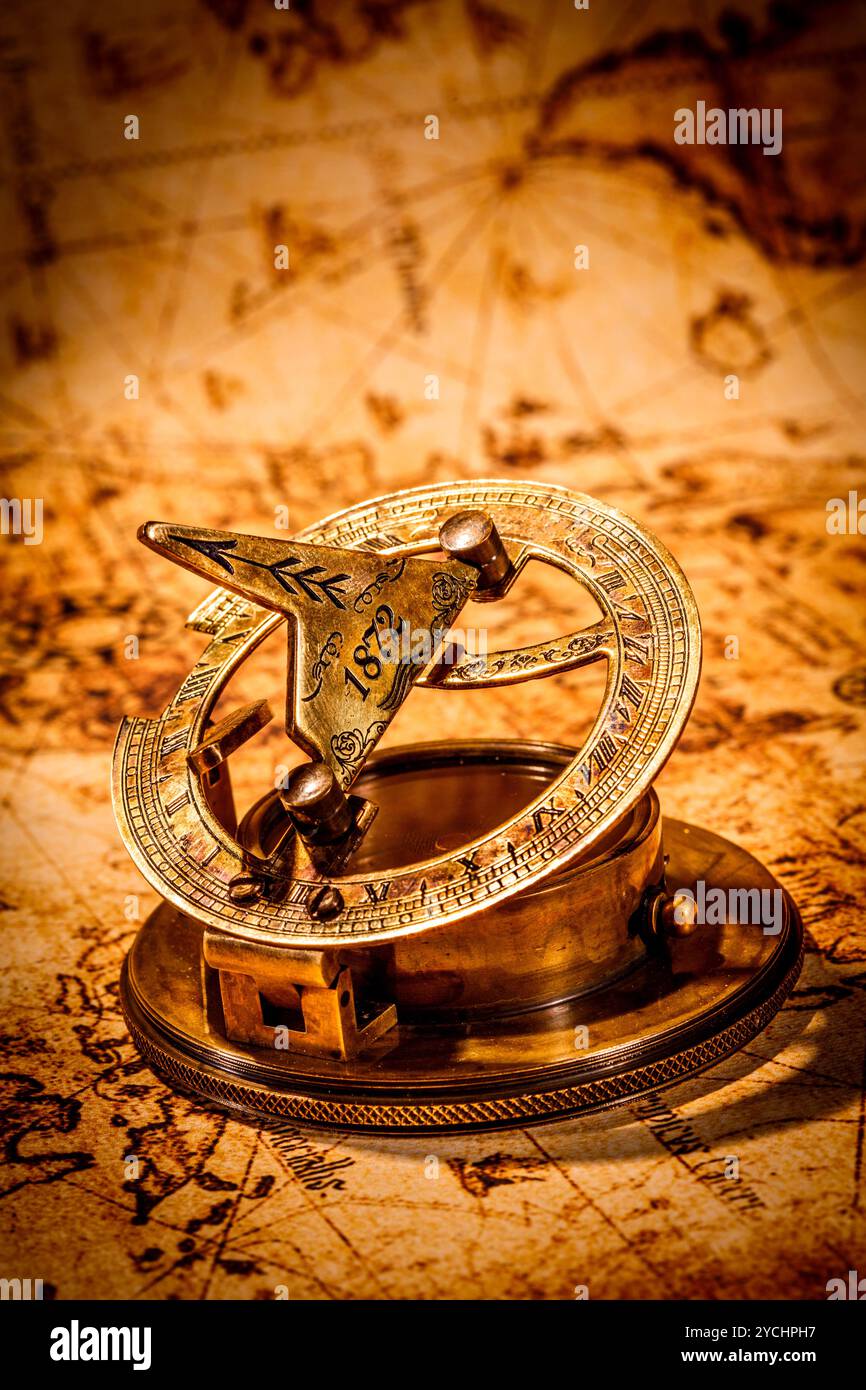 Vintage compass lies on an ancient world map Stock Photo - Alamy