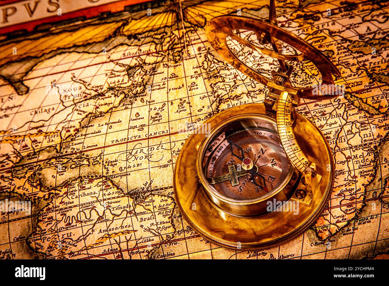 Vintage compass lies on an ancient world map Stock Photo - Alamy