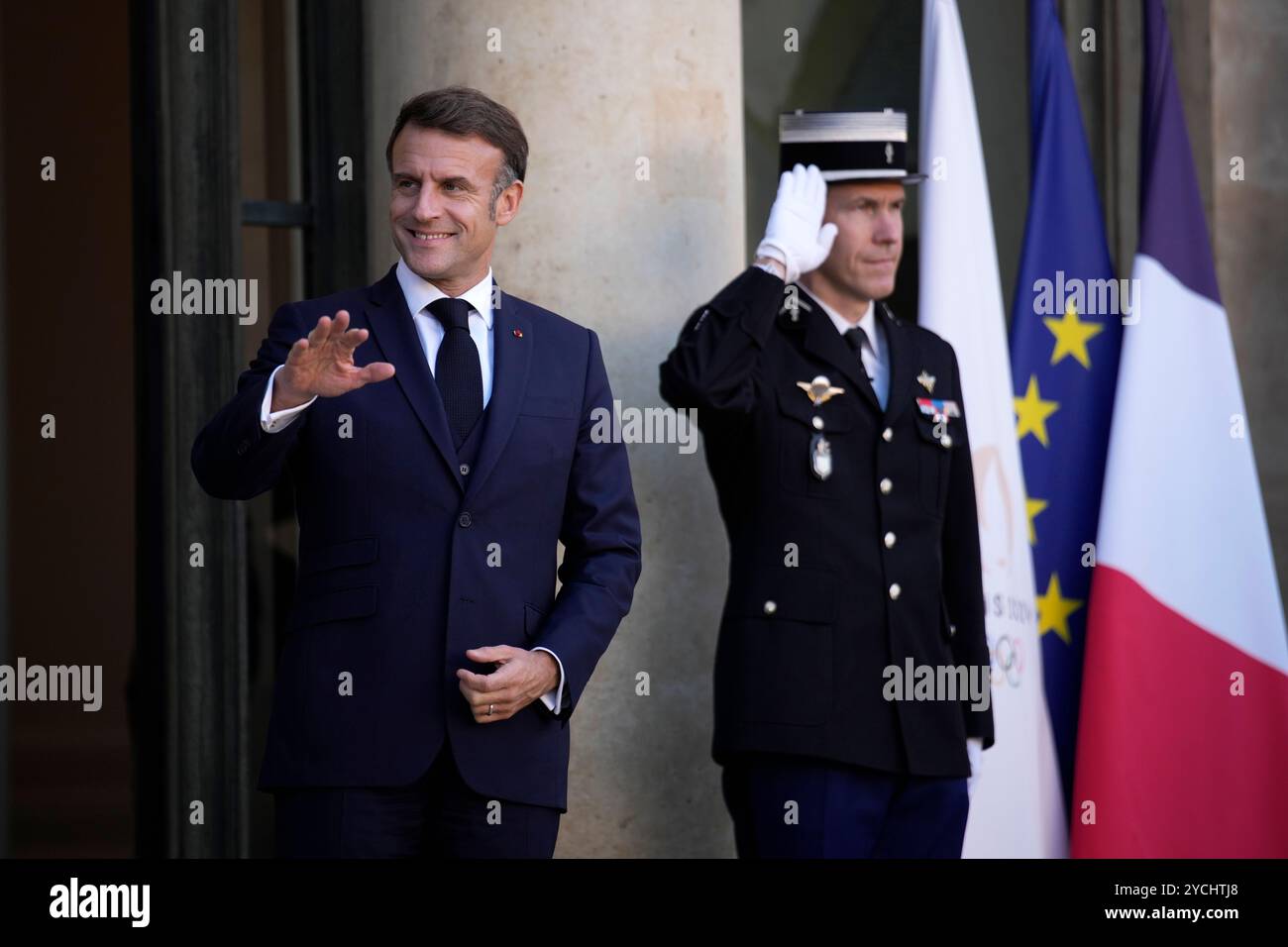 French President Emmanuel Macron waves Wednesday, Oct. 23, 2024 at the ...
