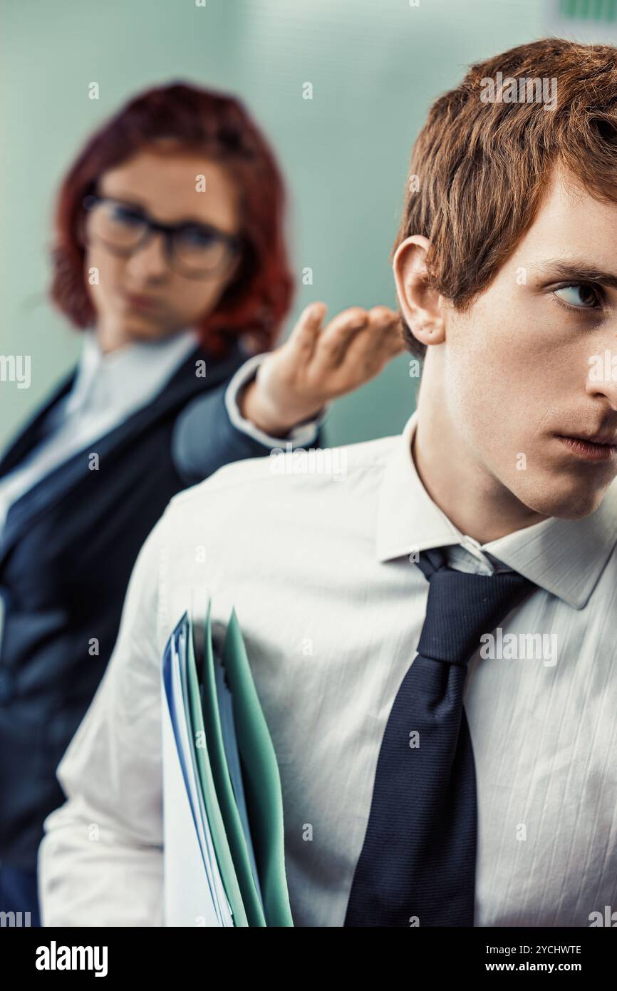 Workplace harassment is captured through subtle body language. A man ...