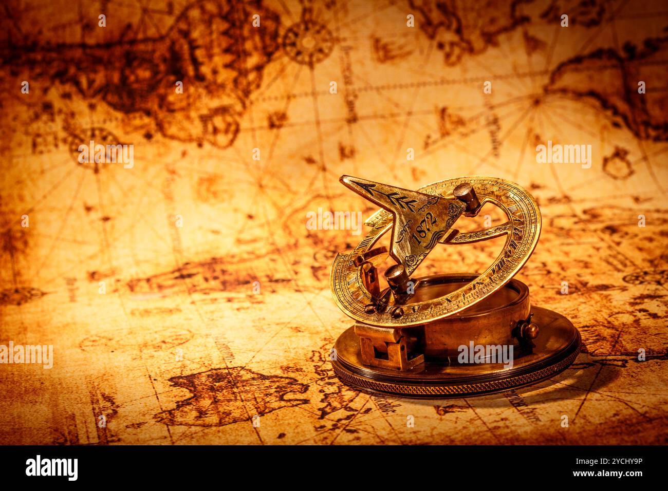 Vintage compass lies on an ancient world map Stock Photo - Alamy