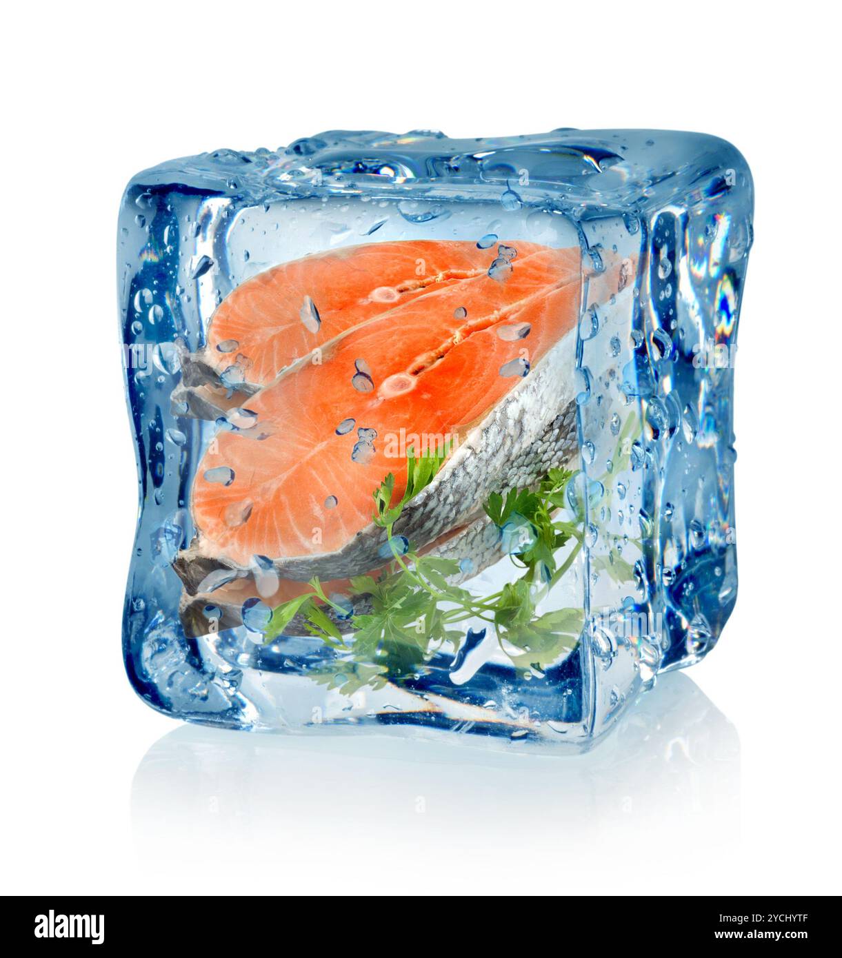 Ice cube and fish with parsley Stock Photo - Alamy