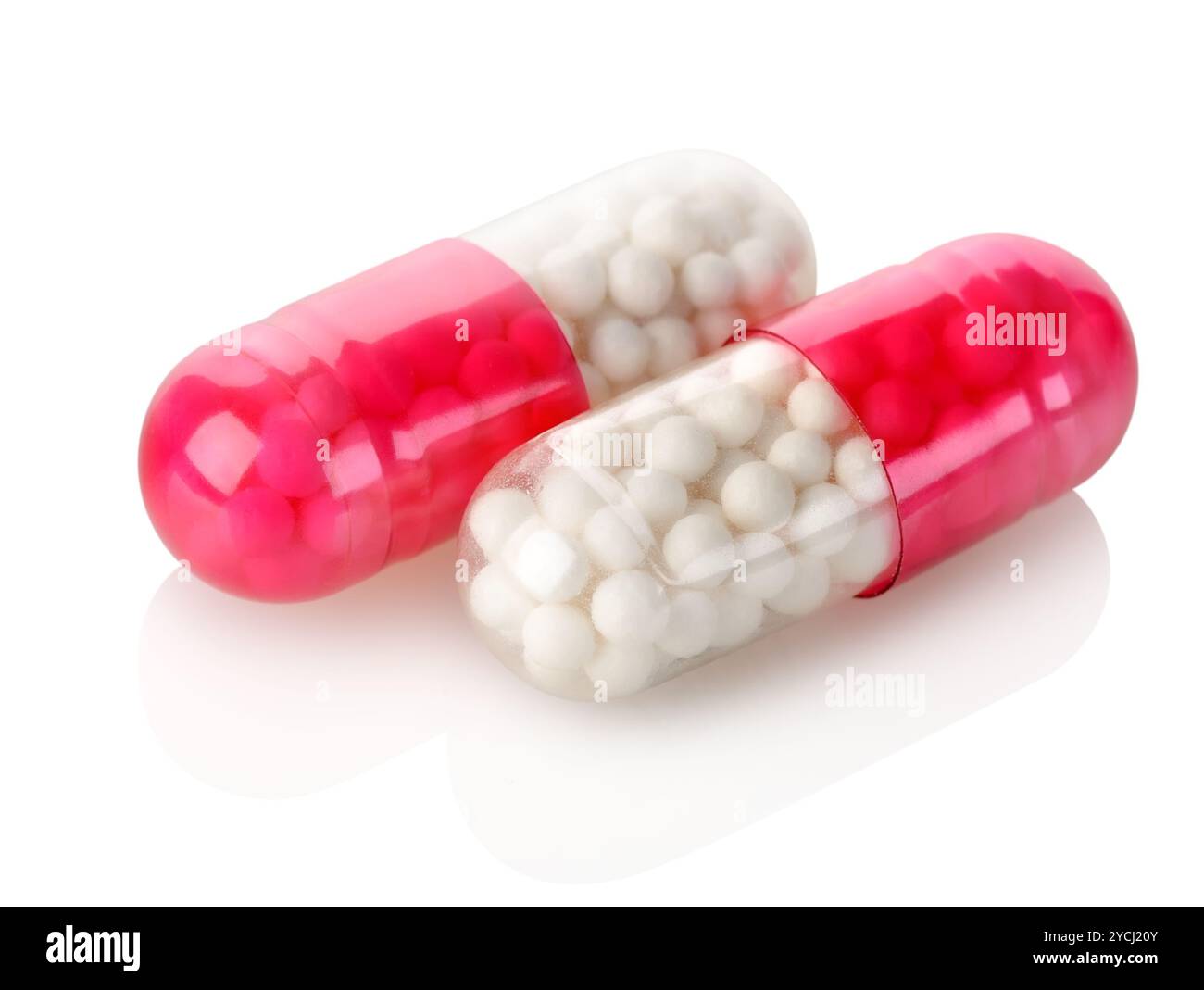 Two red capsules Stock Photo - Alamy