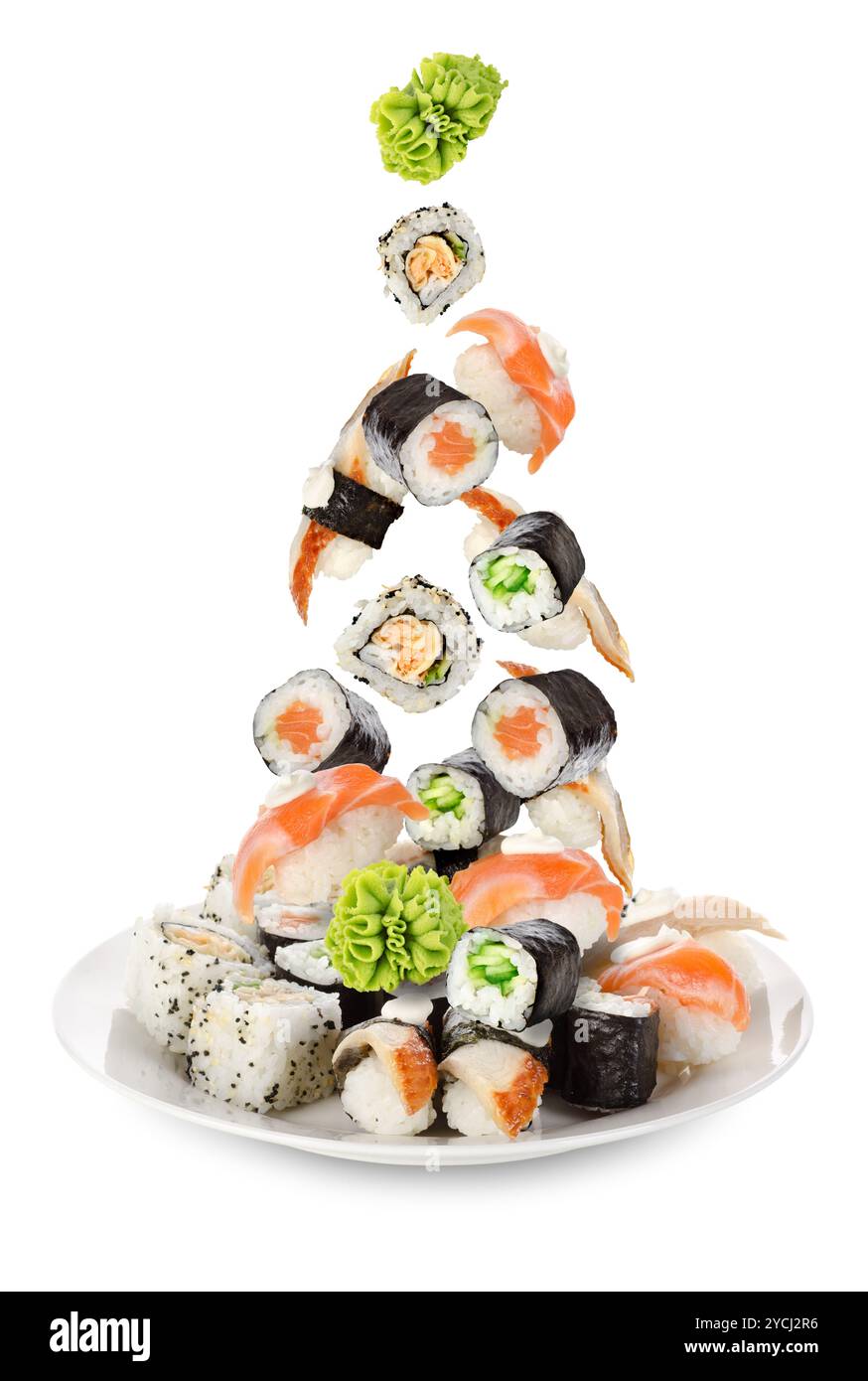 Sushi and rolls falling in the plate. Isolated on white background ...