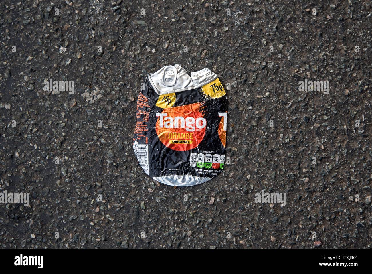 Crushed Tango Orange soft drinks can flatened on the road in Edinburgh ...