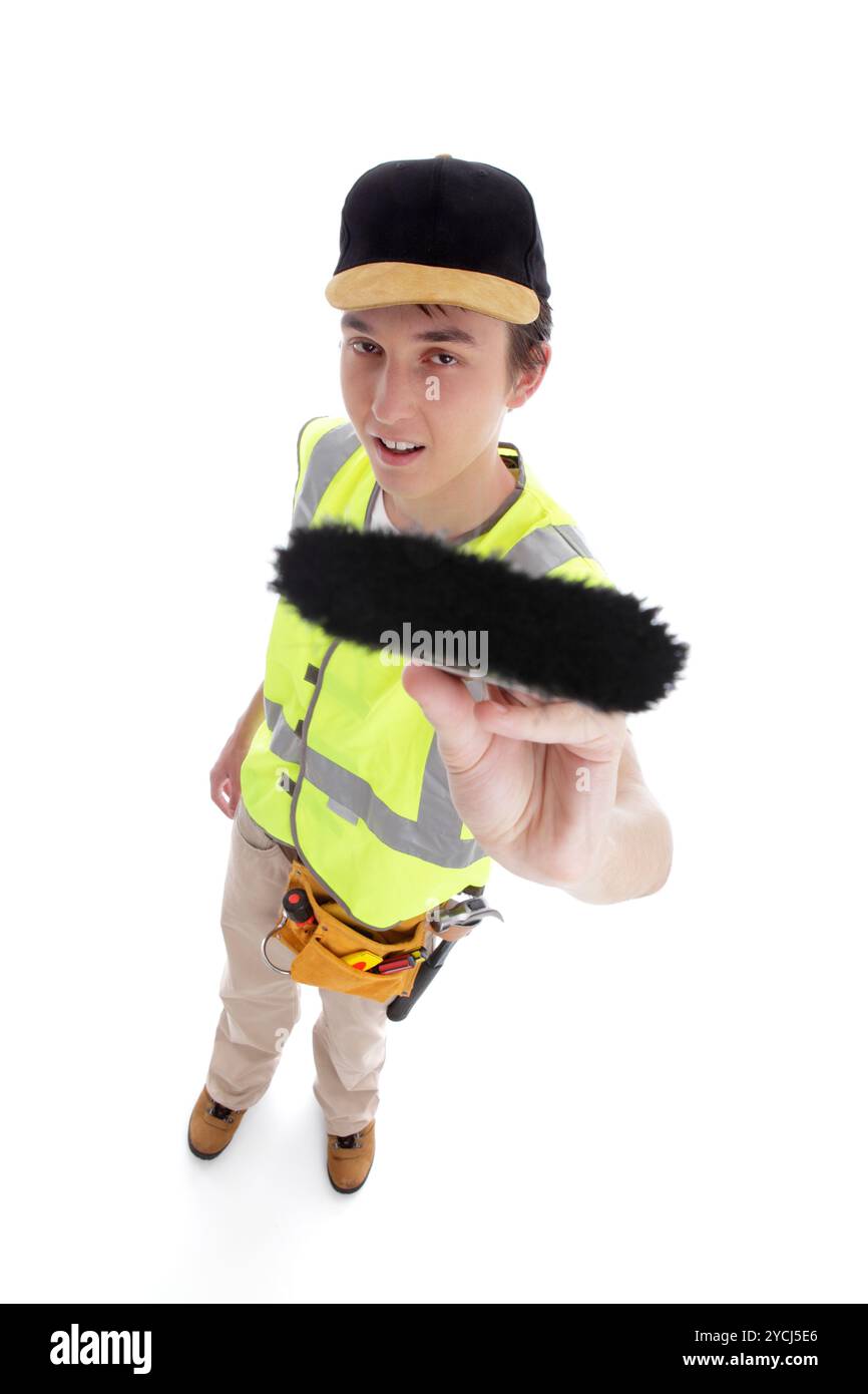 Young handyman teenage apprentice painter wearing work clothes and ...