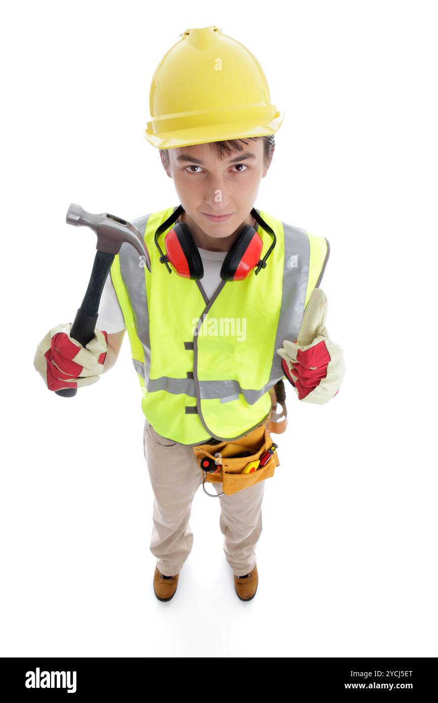 Teenage apprentice builder or technical college tranee student holding ...