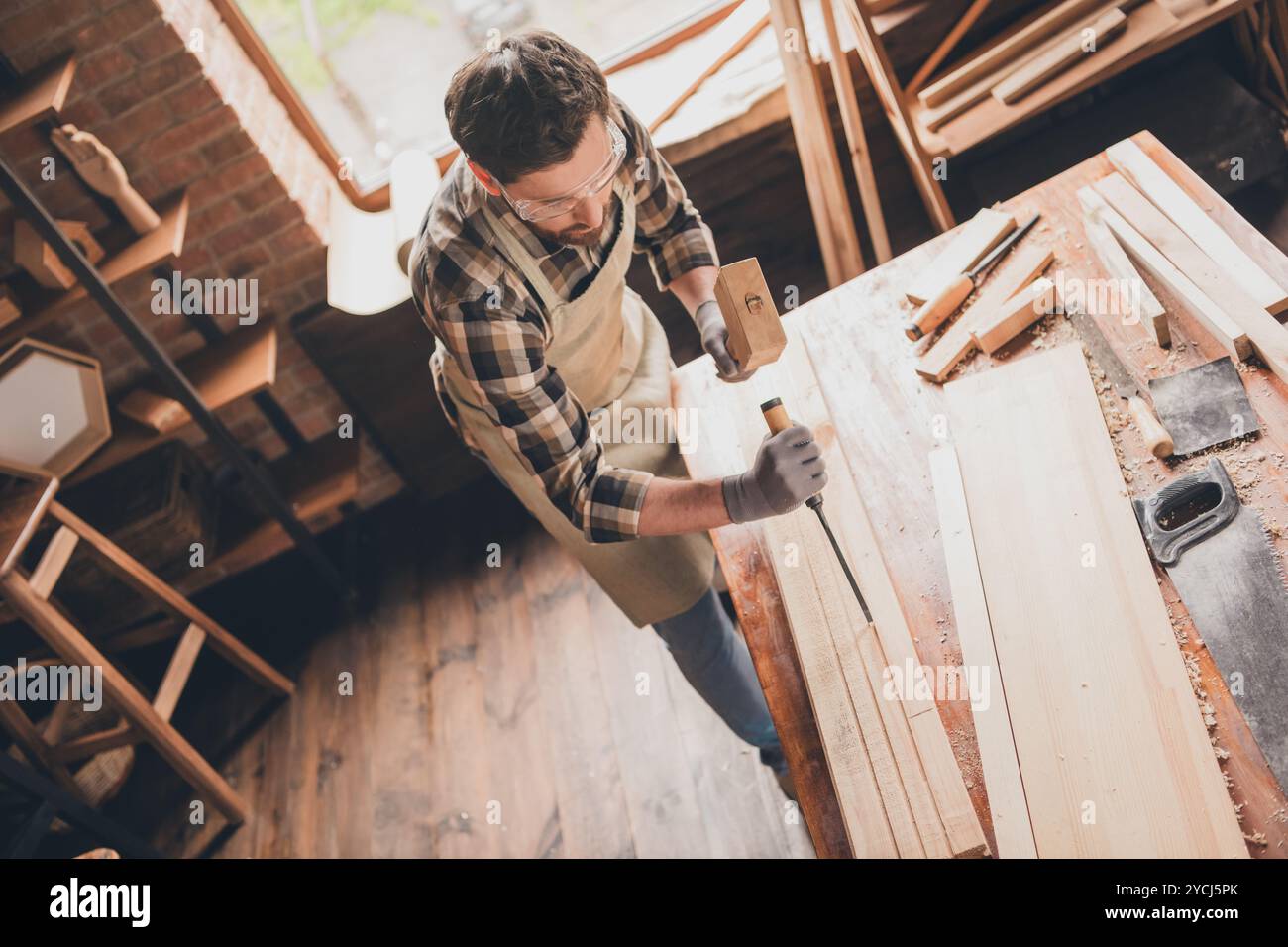 Top photo of builder wood worker guy working using artisan tools in ...