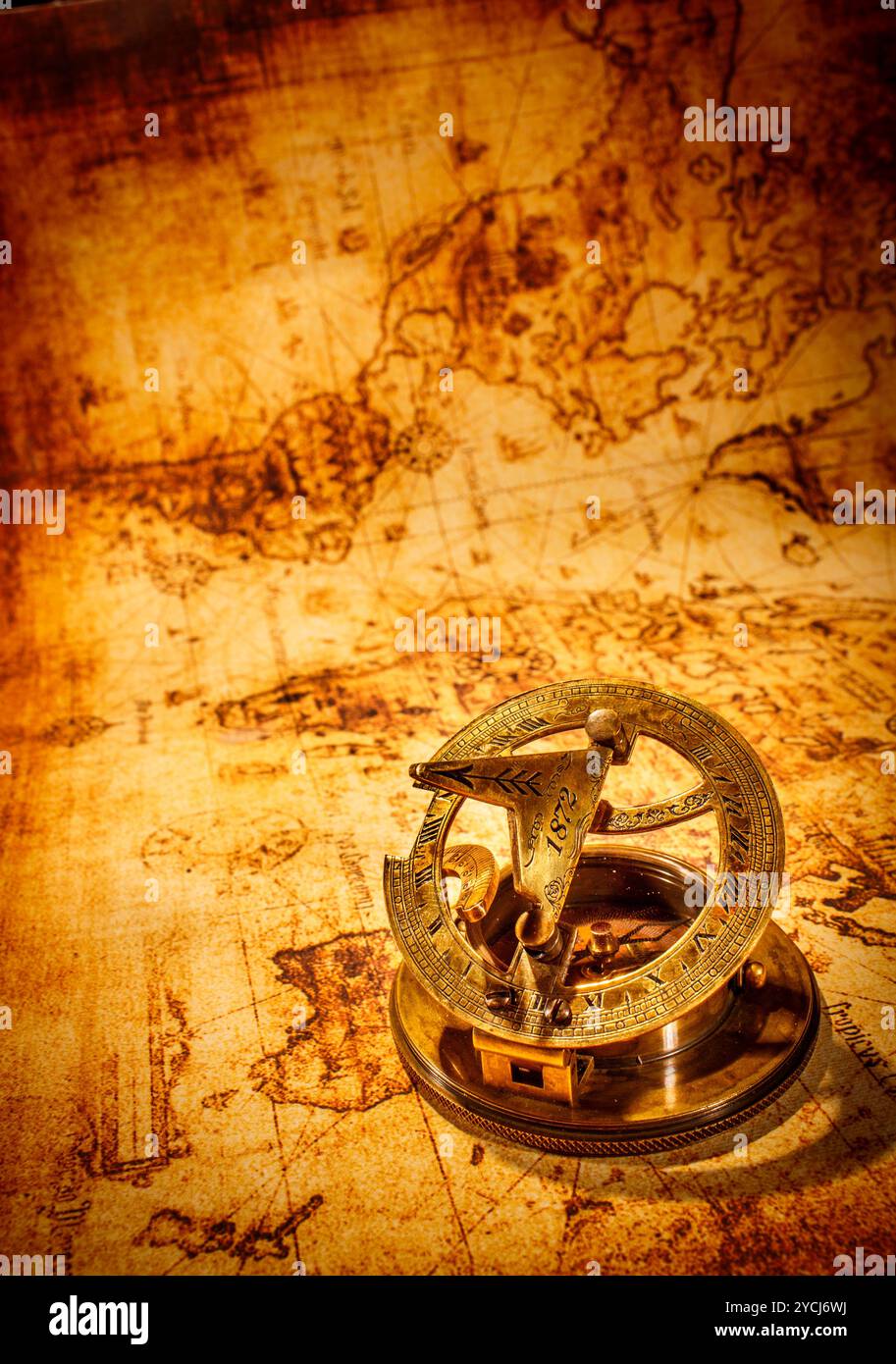 Vintage compass lies on an ancient world map Stock Photo - Alamy