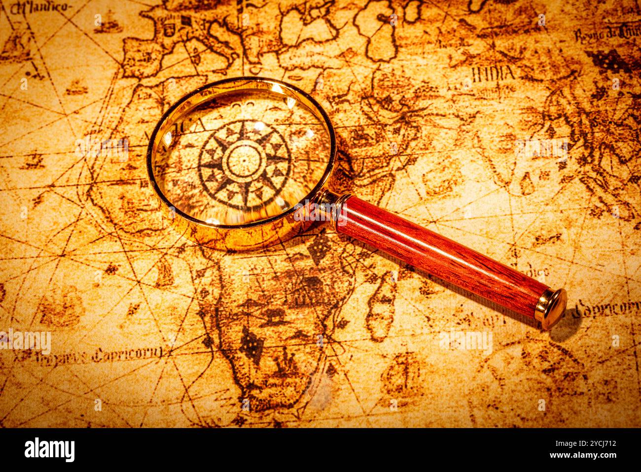 Vintage magnifying glass lies on an ancient world map Stock Photo - Alamy