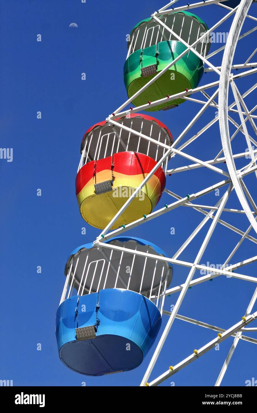 Vivid Ferris Wheel and Moon Stock Photo - Alamy