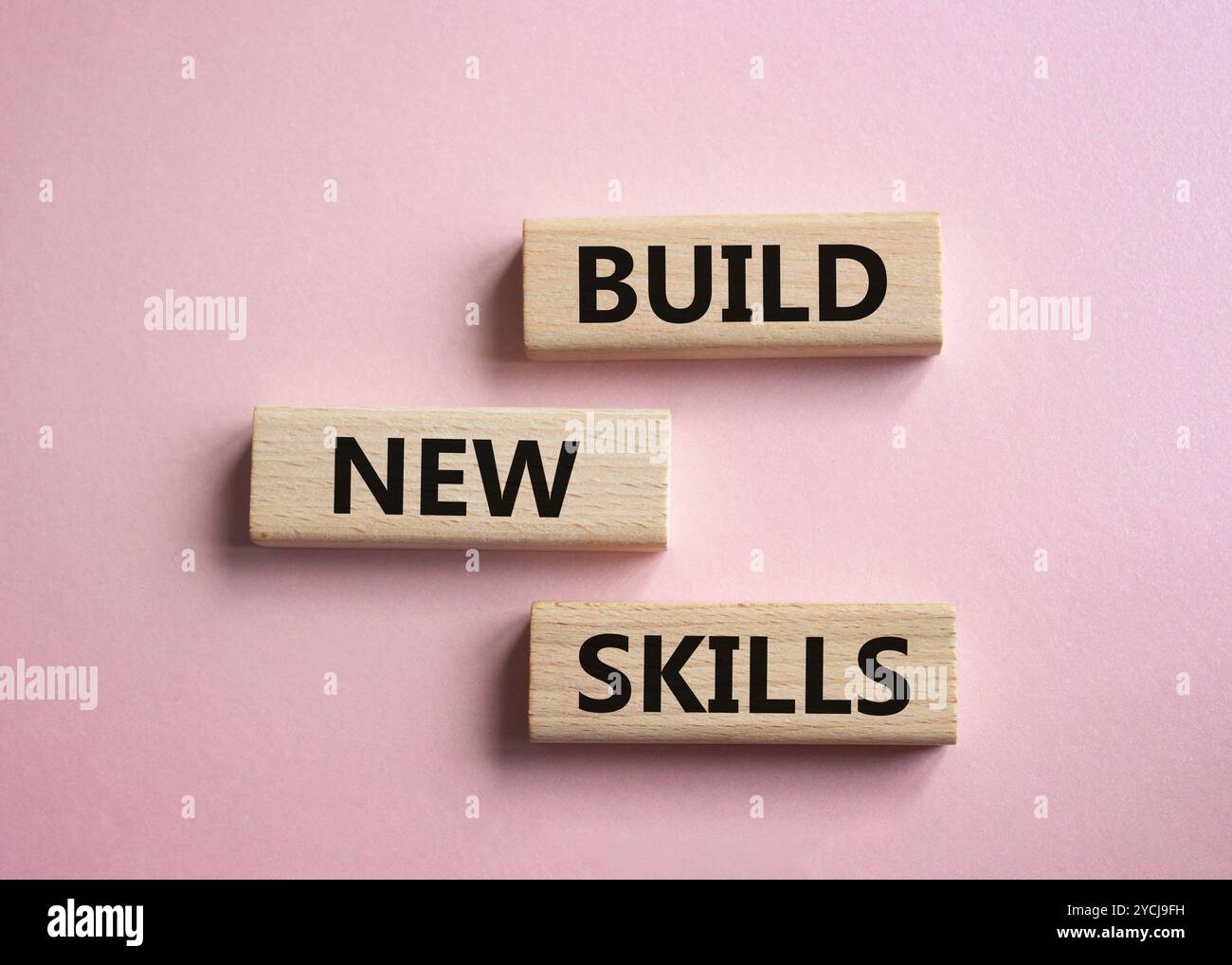 Build New skills symbol. Concept word Build New skills on wooden blocks ...