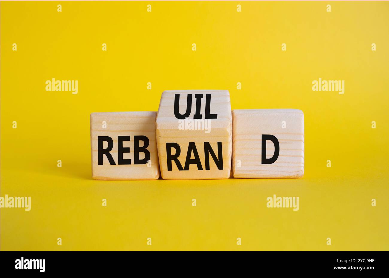Rebuild and Rebrand symbol. Wooden cubes with words Rebrand and Rebuild ...