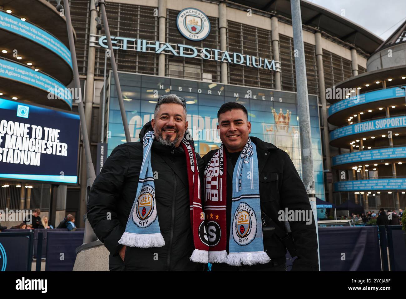 Fans pose for a photo outside of the Etihad Stadium ahead of the UEFA ...