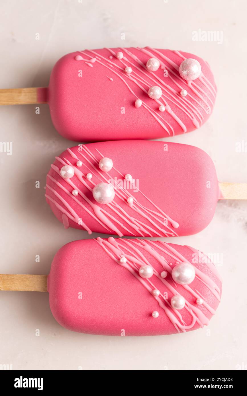 Vegan ice cream on a stick in raspberry glaze, decorated with edible ...