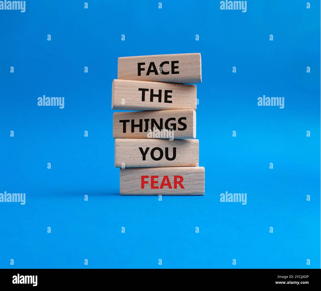 Face the things you fear symbol. Wooden blocks with words Face the ...