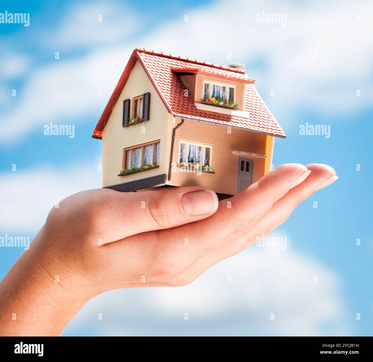 House in human hands Stock Photo - Alamy