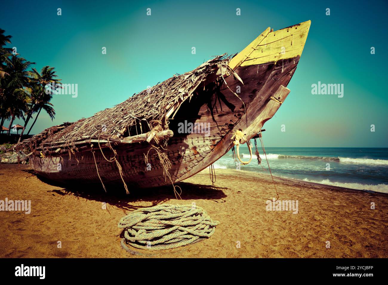 Tropical beach landscape with fishing boat Stock Photo - Alamy