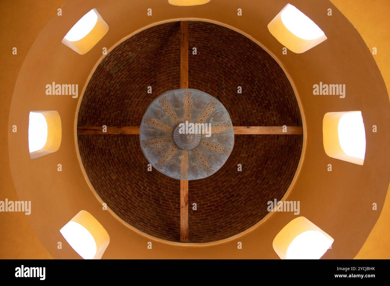Intricate dome ceiling with brick and wood beams seen from below Stock ...