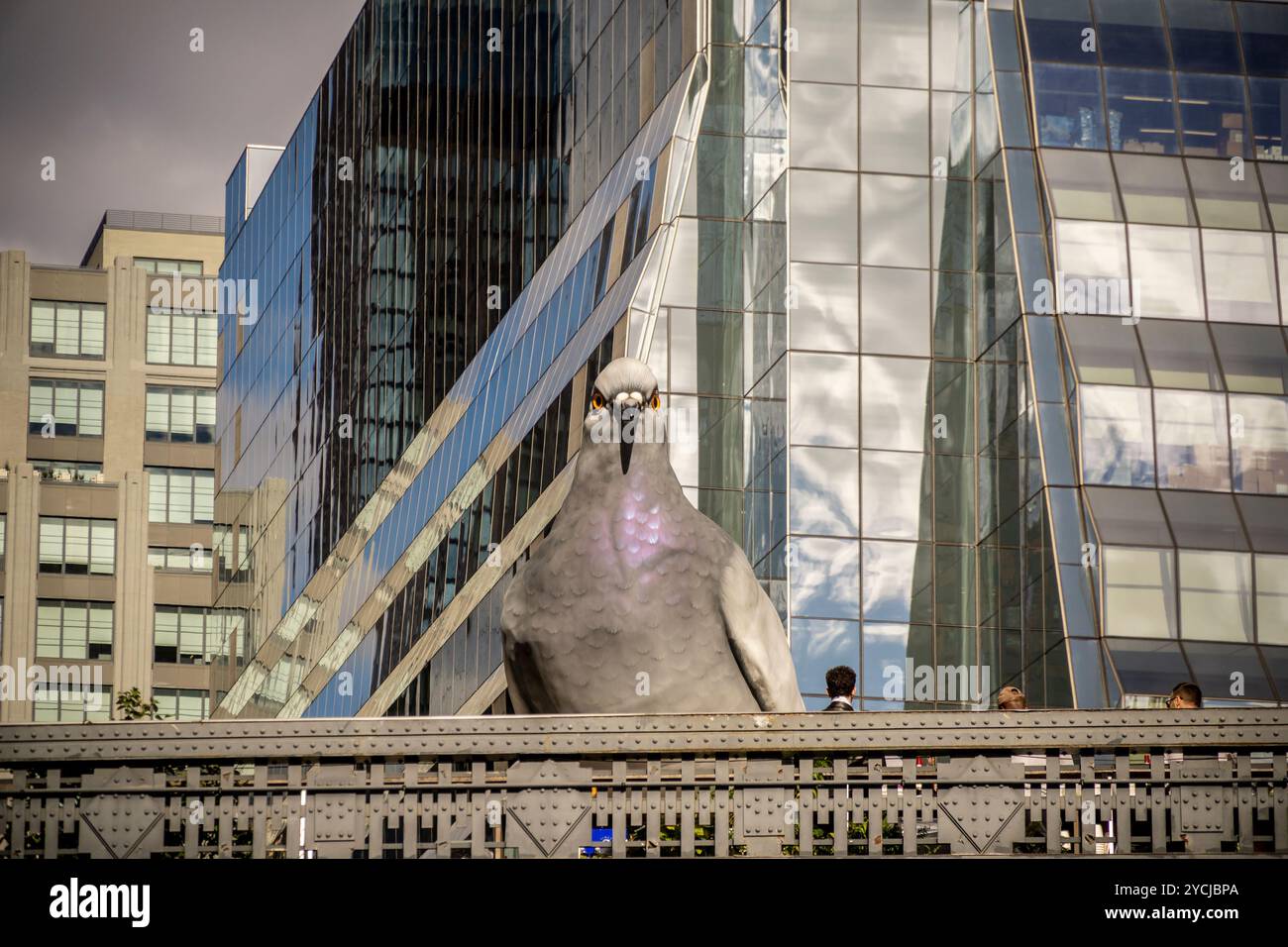 Workers finish up installation of “Dinosaur” (2024) by the artist Iván ...