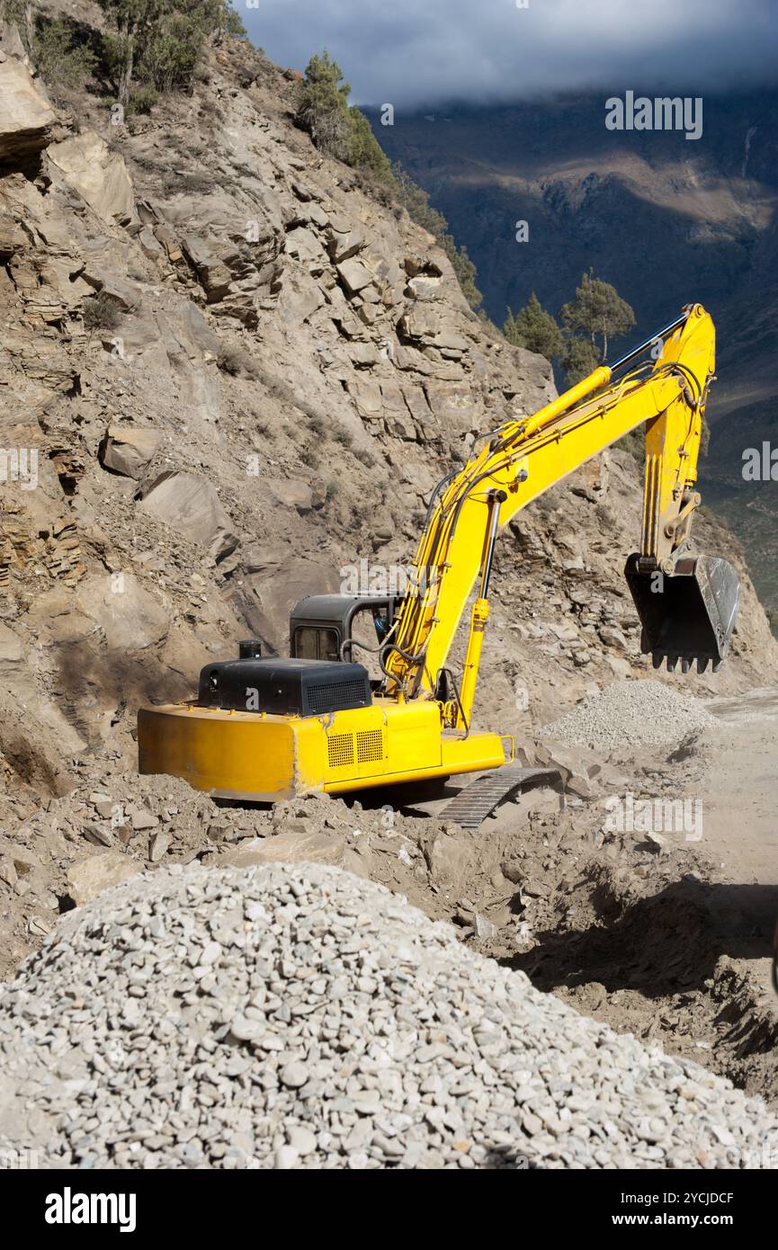 Heavy road construction elevator machine in Himalaya mountains. India ...