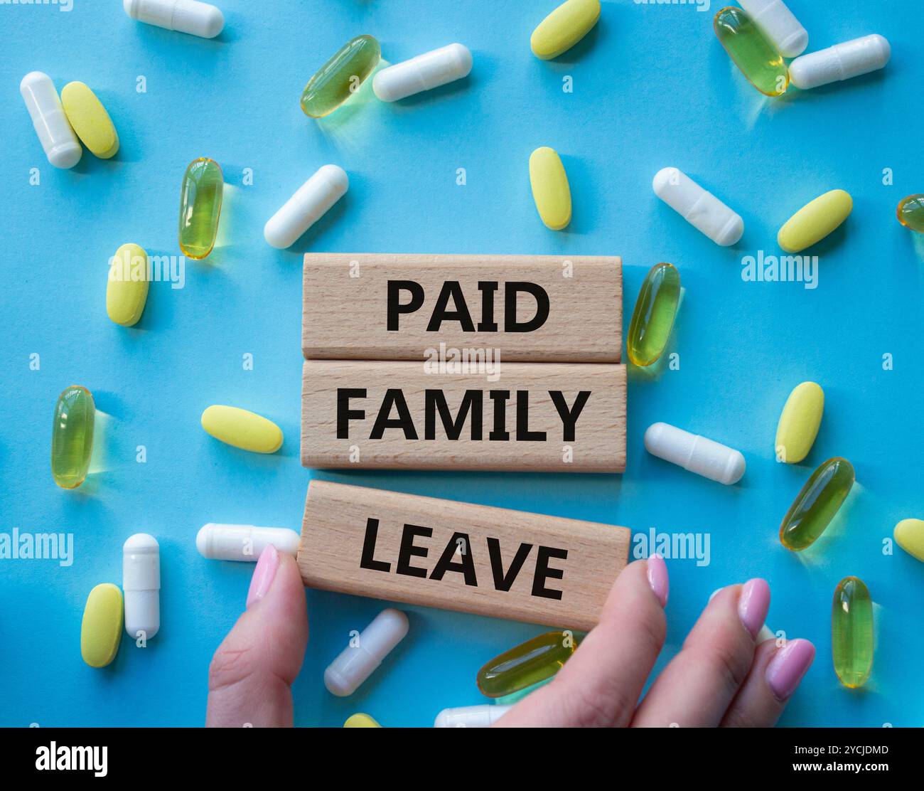 Paid Family Leave symbol. Concept words Paid Family Leave on wooden ...