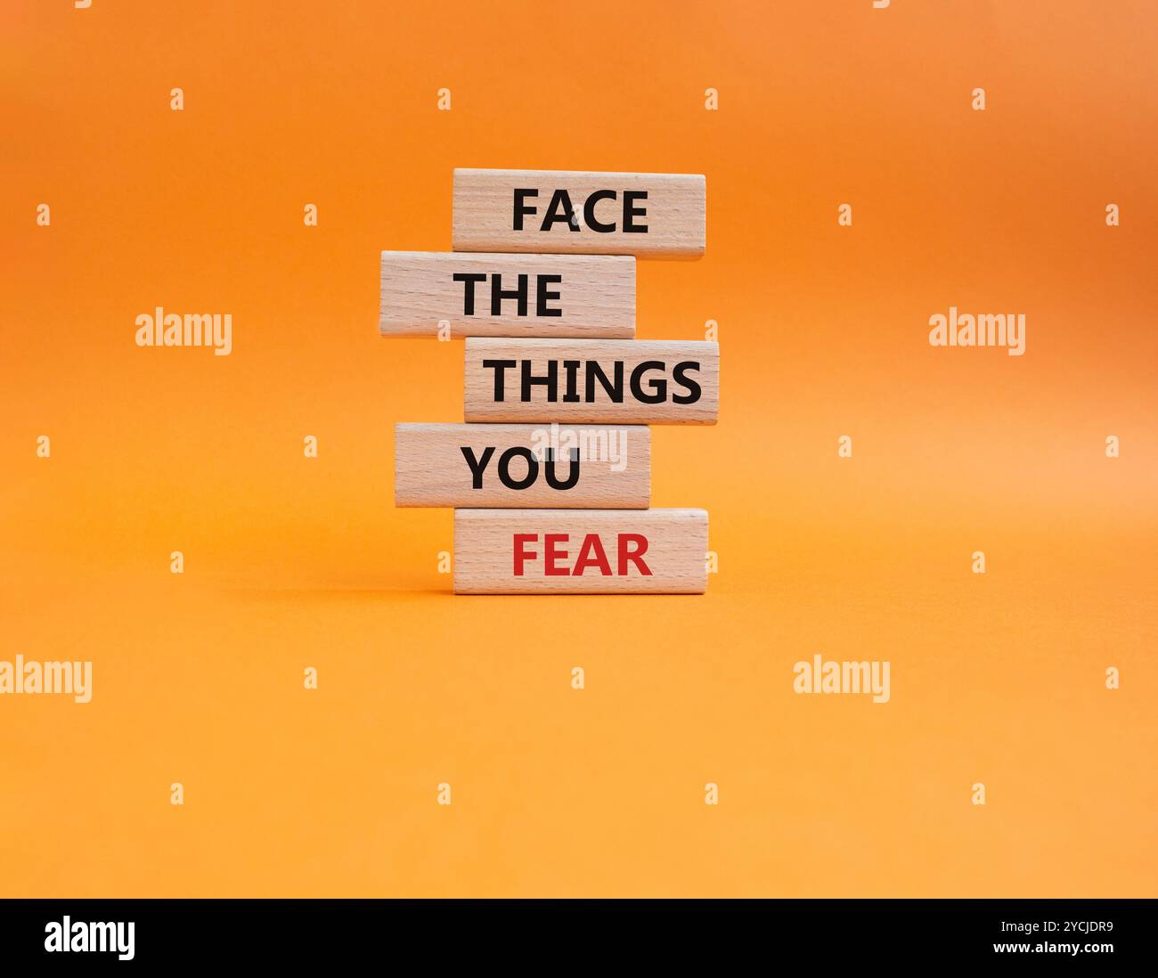 Face the things you fear symbol. Wooden blocks with words Face the ...
