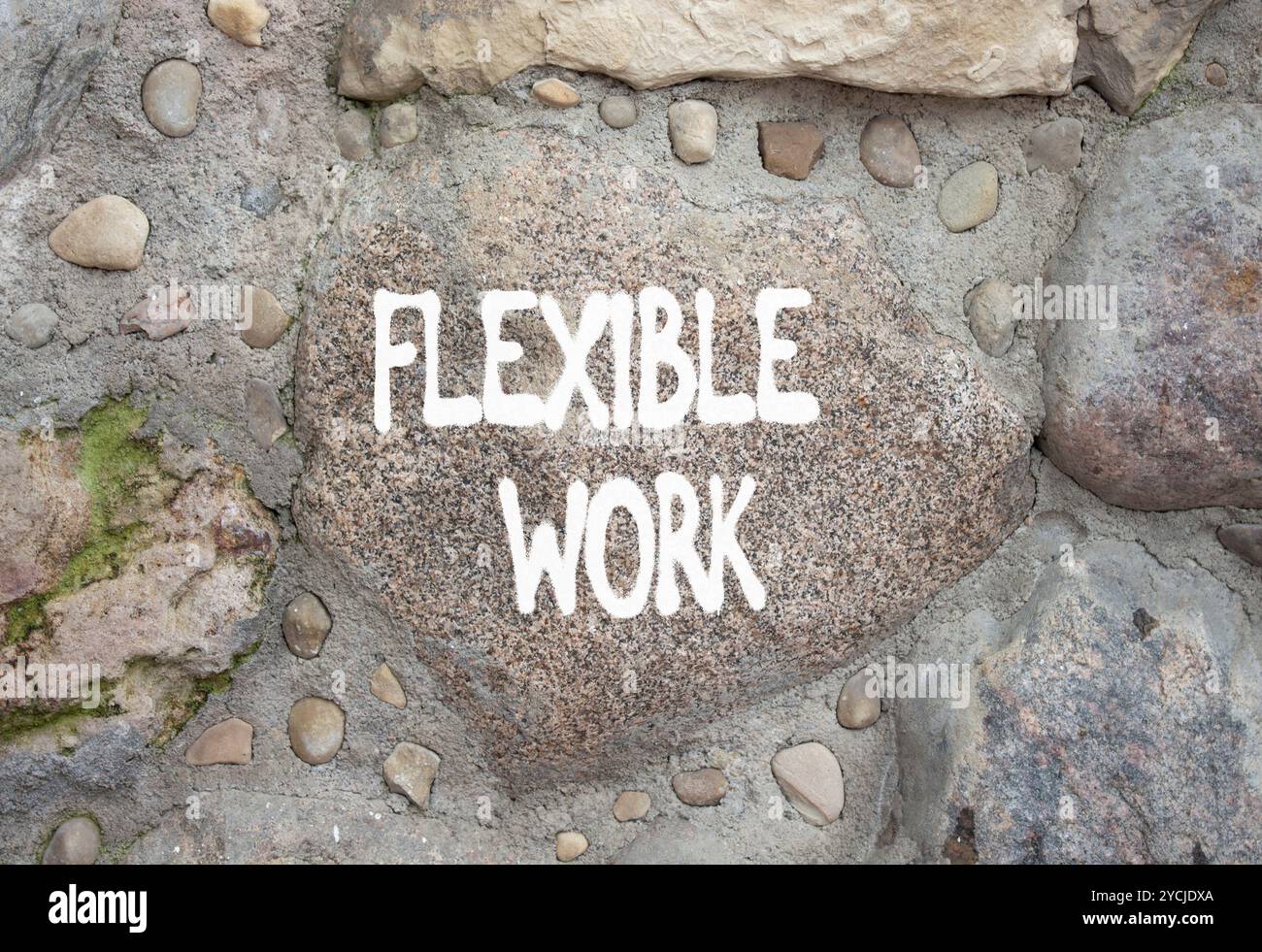 Flexible work symbol. Stone wall with words Flexible work. Beautiful ...