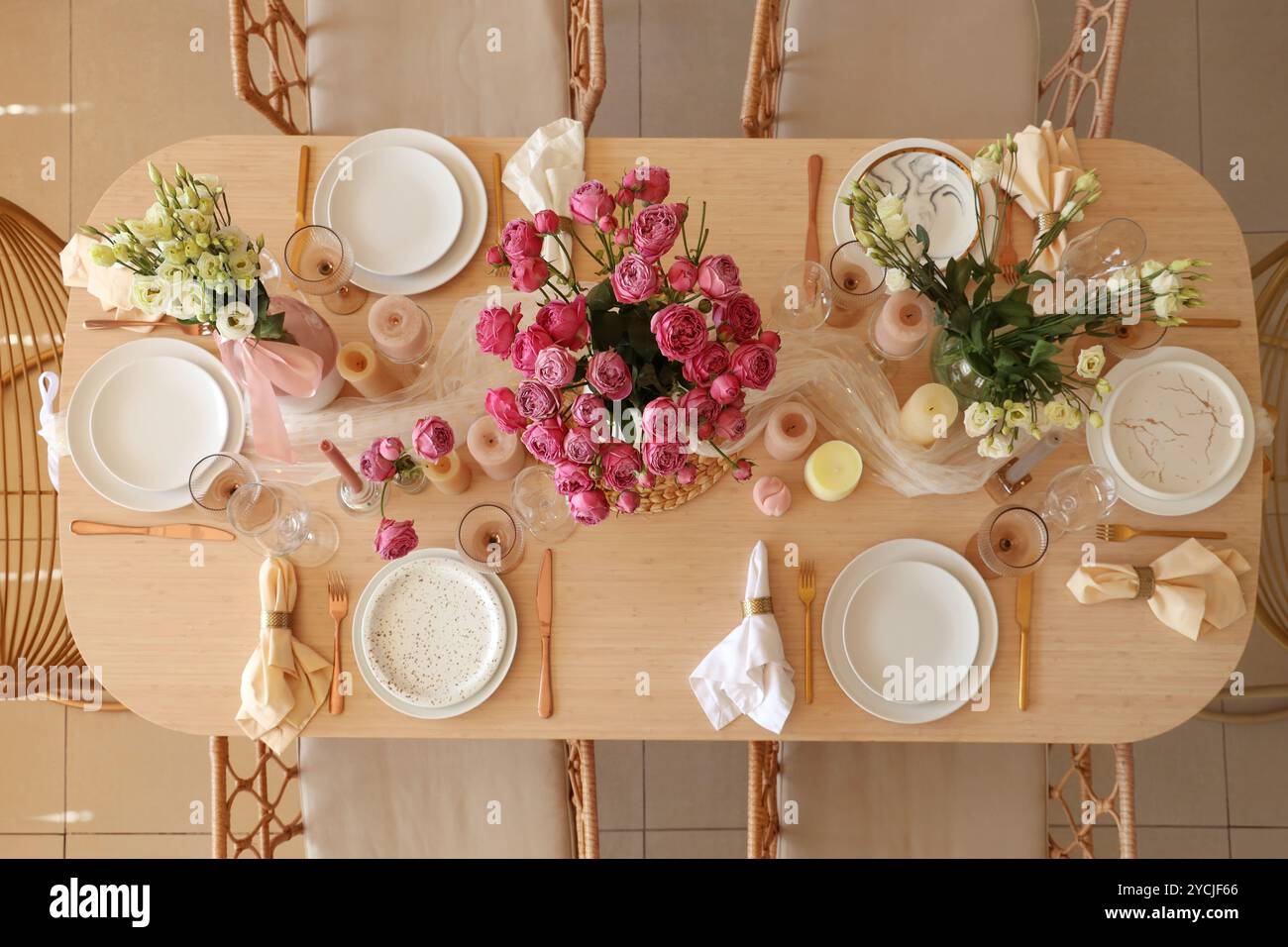 Beautiful table setting with flowers and candles for wedding ...