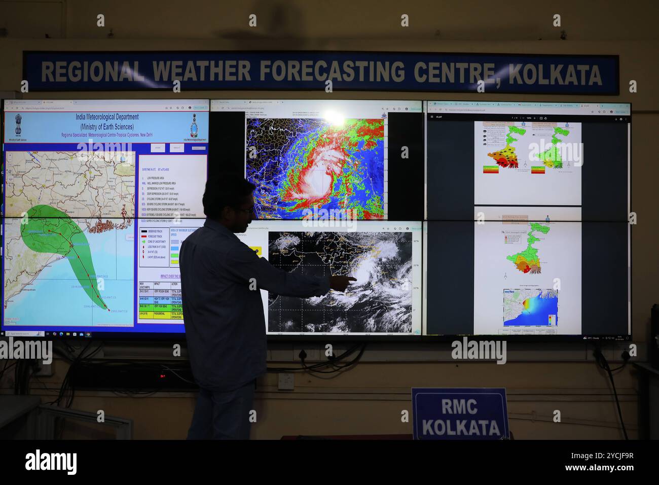 Cyclone Dana alert in Kolkata, India A scientist at the India ...