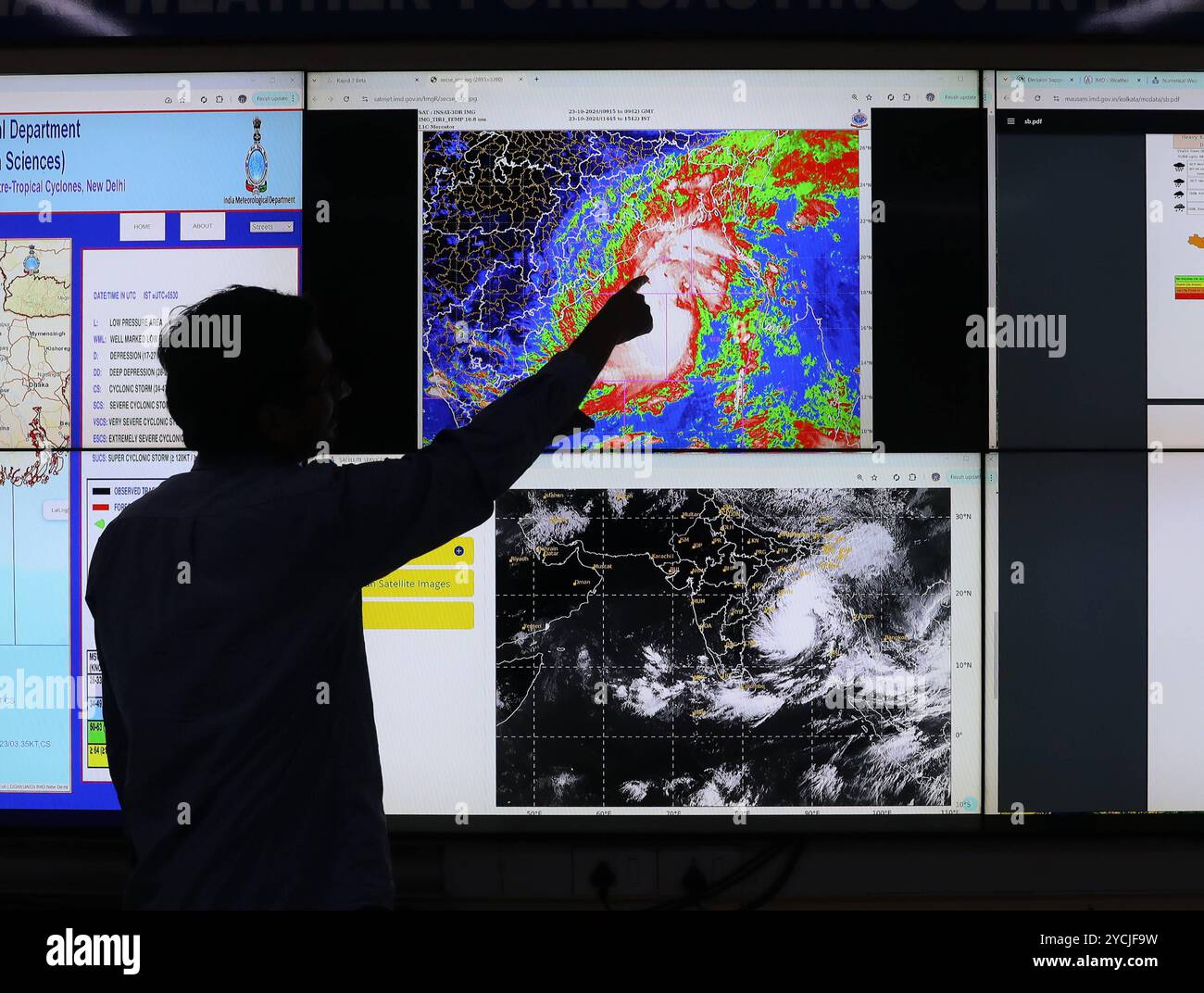 Cyclone Dana alert in Kolkata, India A scientist at the India ...