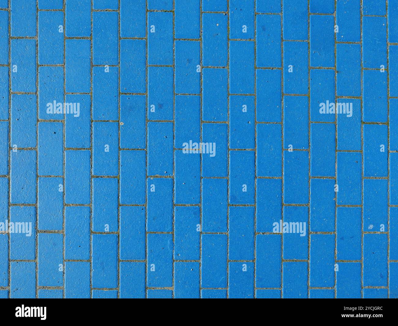 The bright blue of the pavement stands out and draws attention to the ...