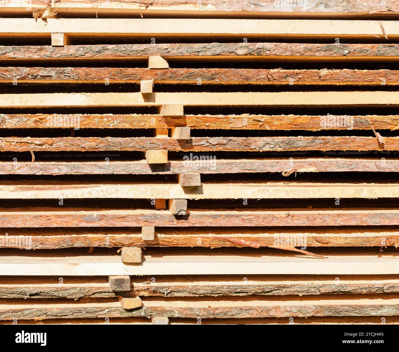 Stacked lumber background Stock Photo - Alamy