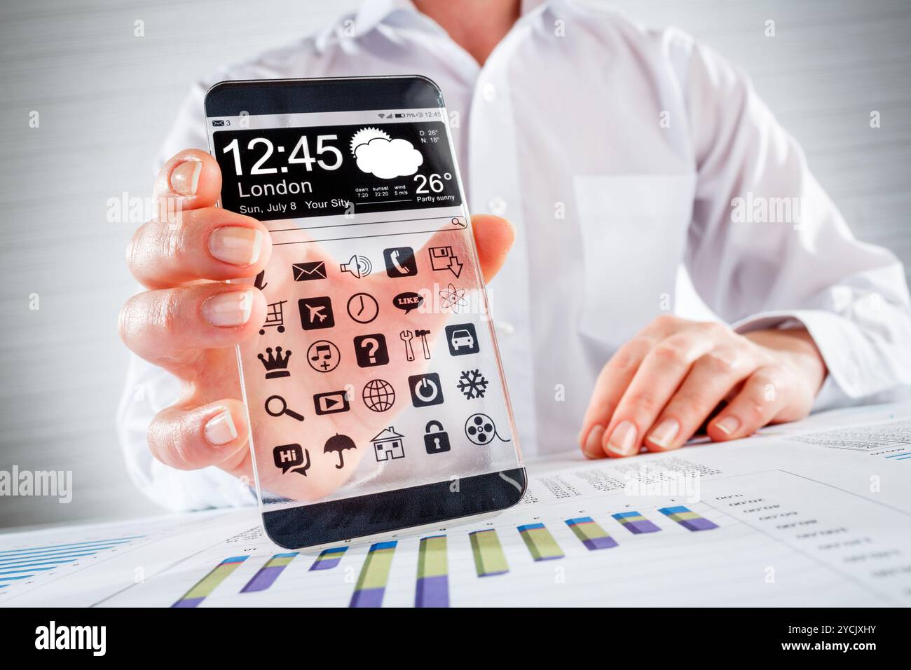 Smartphone (phablet) with a transparent display in human hands. Concept ...
