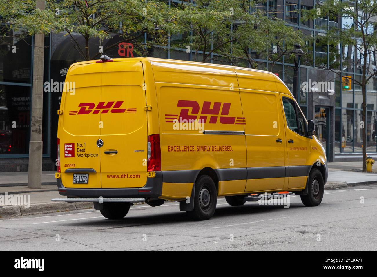 Ottawa, Canada - October 1, 2024: Yellow DHL delivery van on the road ...