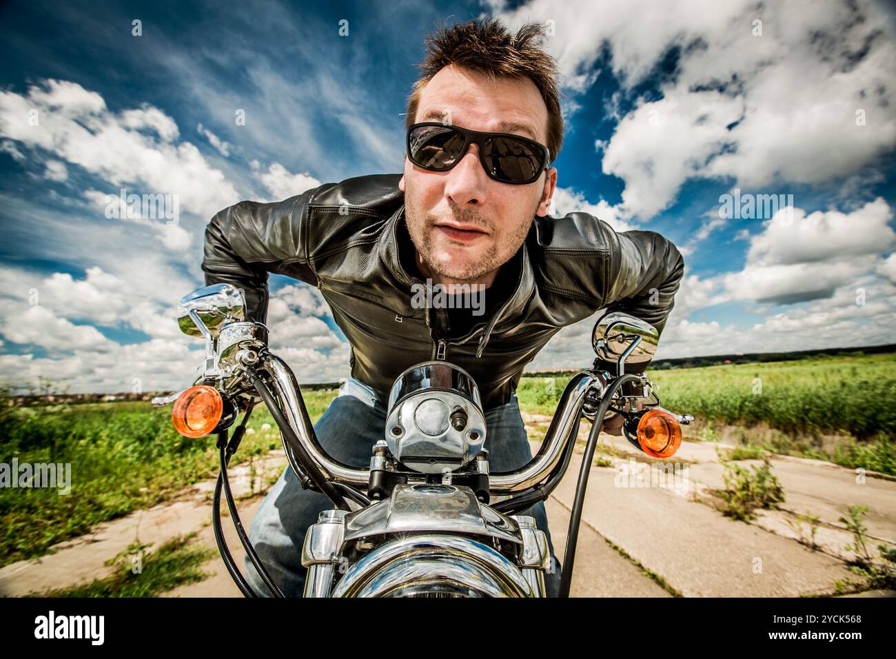 Biker racing on the road Stock Photo - Alamy