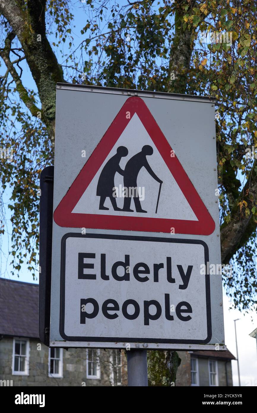 Elderly people crossing road sign. warning sign for motorists in area ...