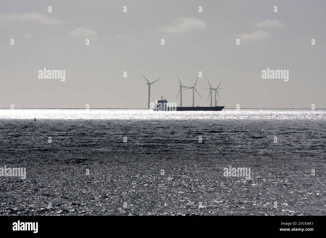 A ship passes in front of part of the Rampion Wind Farm offshore of ...