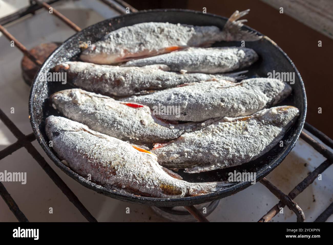 Fish fried in hot oil hi-res stock photography and images - Alamy