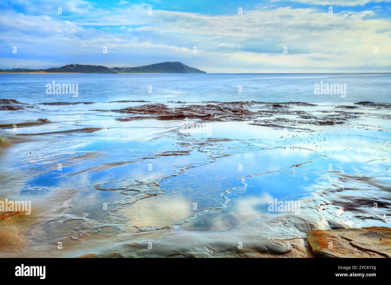 Reflections in the shallow rock pools and lots of different textures in ...