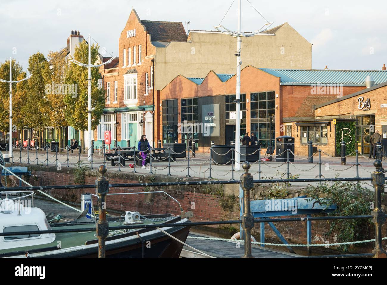 View of Humber Dock St, Hull, from across the Marina. Single woman ...