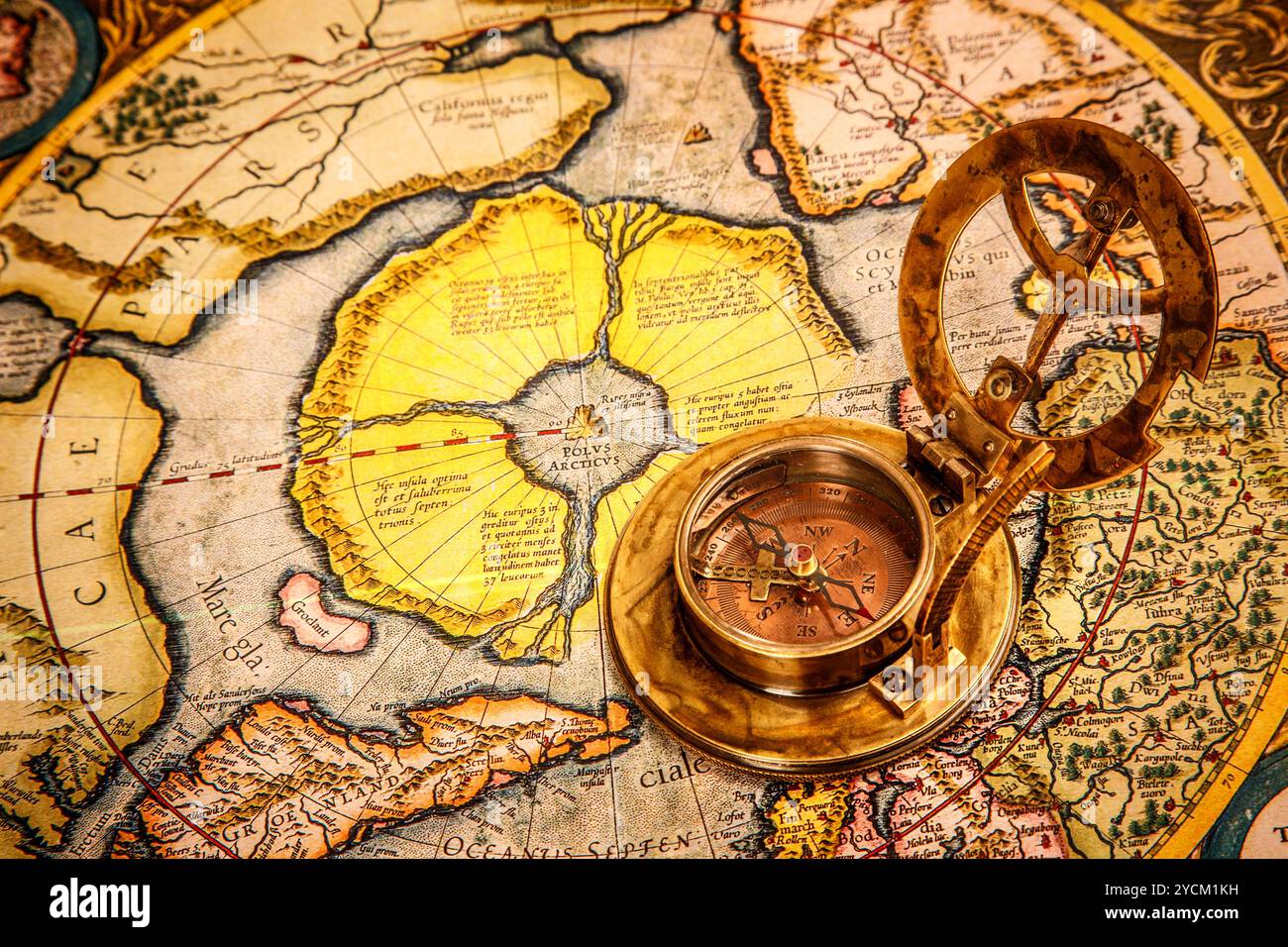 Vintage compass lies on the ancient map of the North Pole (also ...