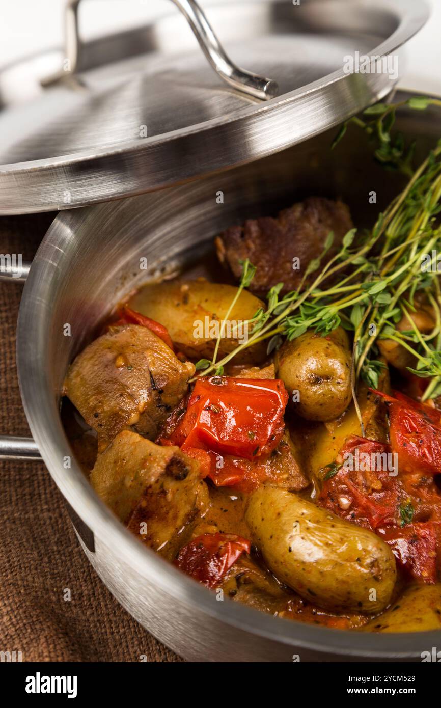 Hot roast with tongue and vegetables in metal pan with lid Stock Photo ...